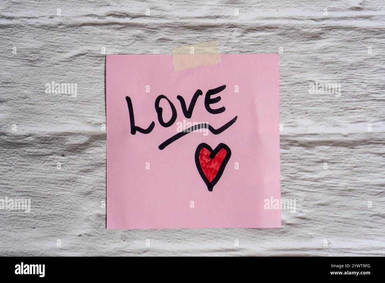 Sticky note with LOVE word handwritten message Stock Photo - Alamy