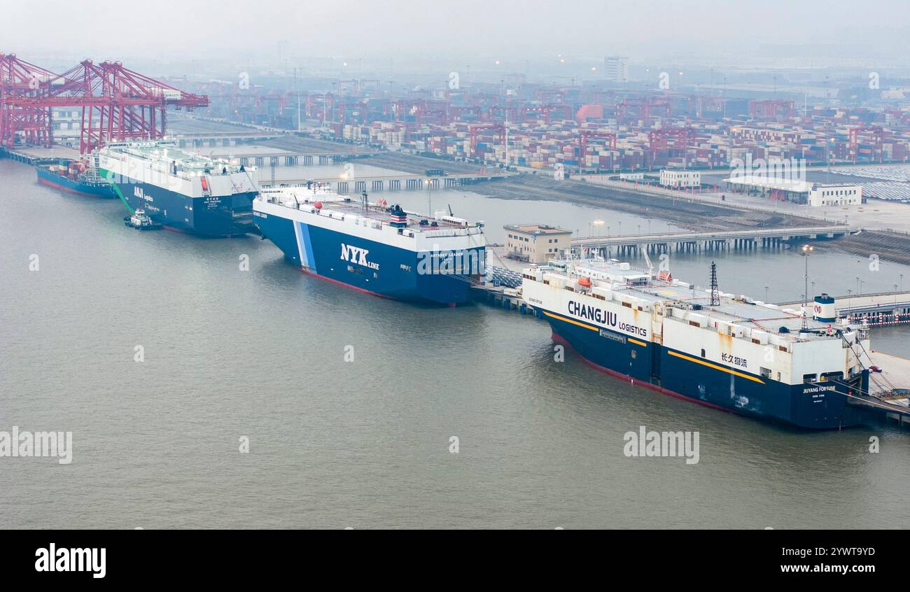 Cars are loaded and unloaded at a ro-ro vehicle terminal for export at ...