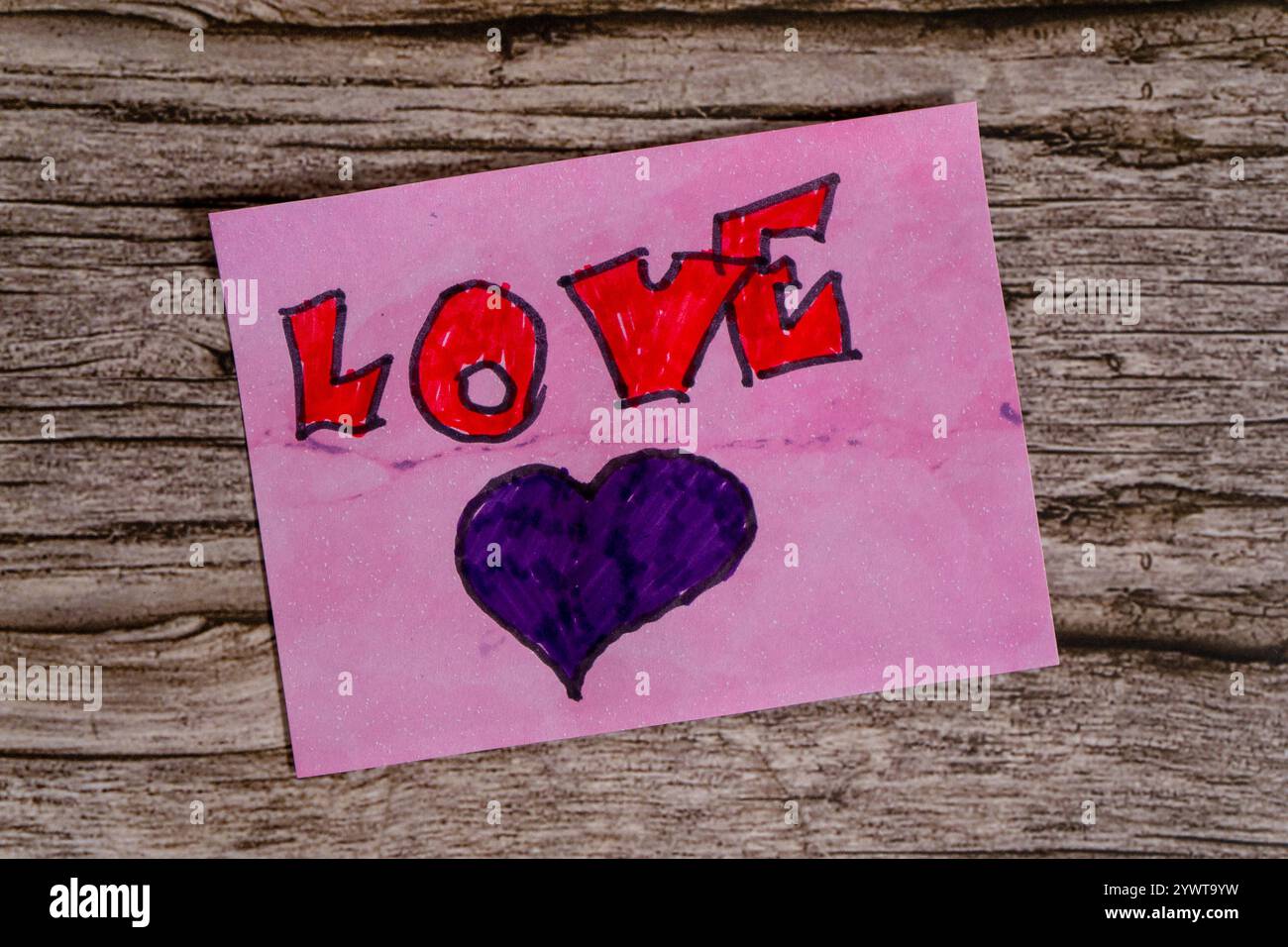 Sticky note with LOVE word handwritten message Stock Photo - Alamy