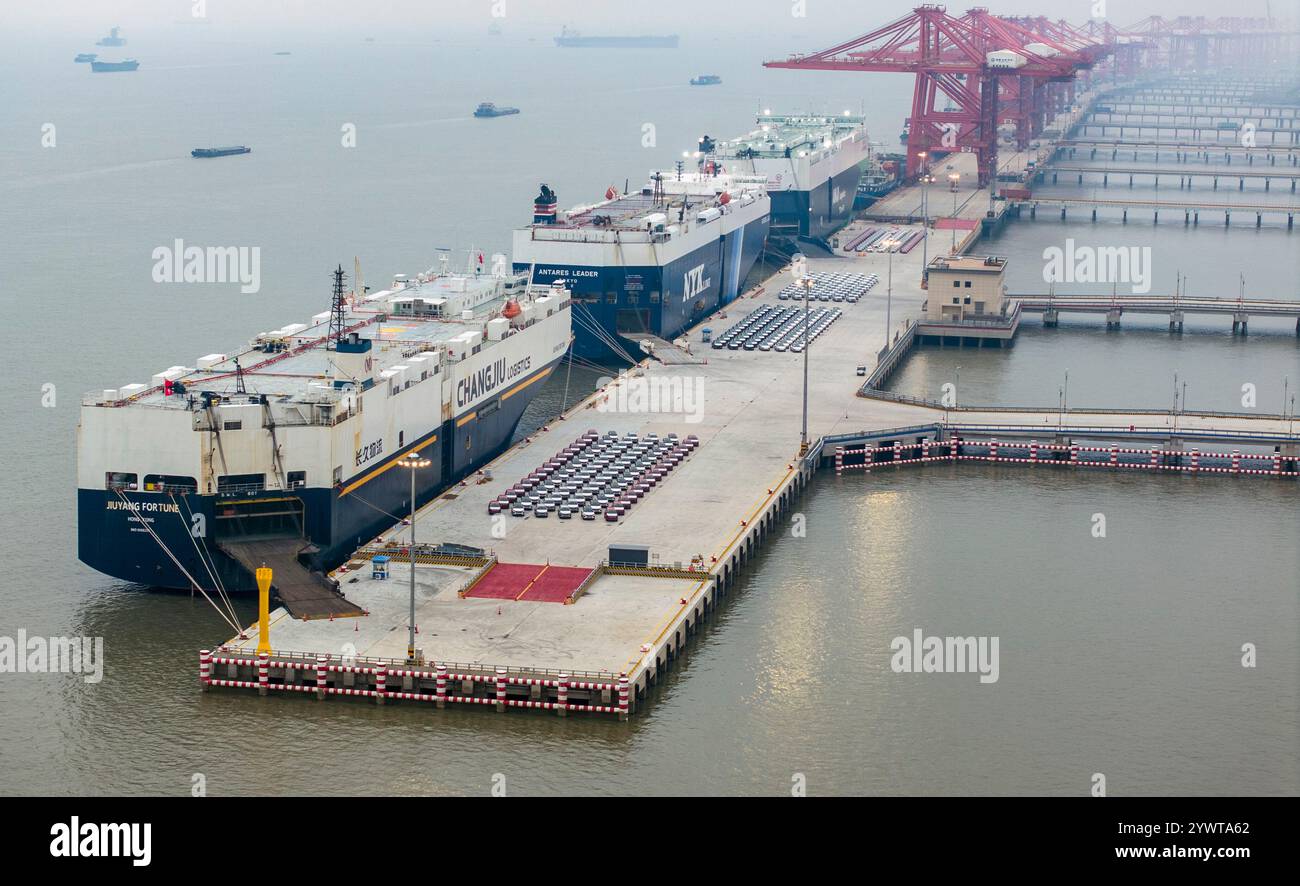 Cars are loaded and unloaded at a ro-ro vehicle terminal for export at ...