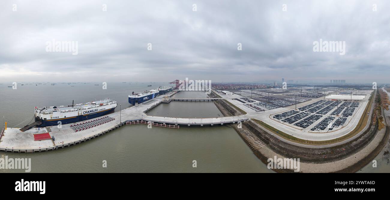 Cars are loaded and unloaded at a ro-ro vehicle terminal for export at ...
