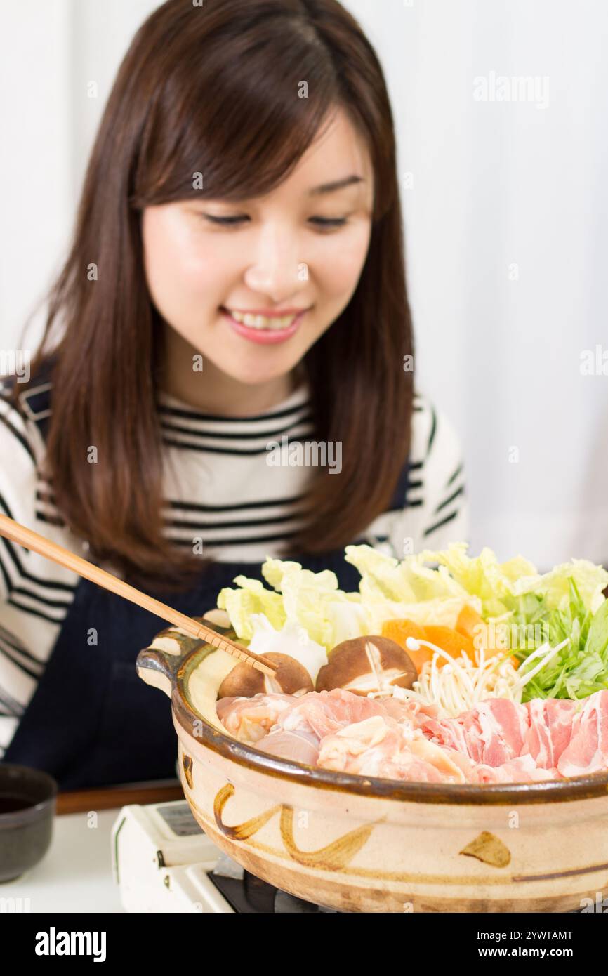 Japanese couple eating a nabe dish Stock Photo - Alamy