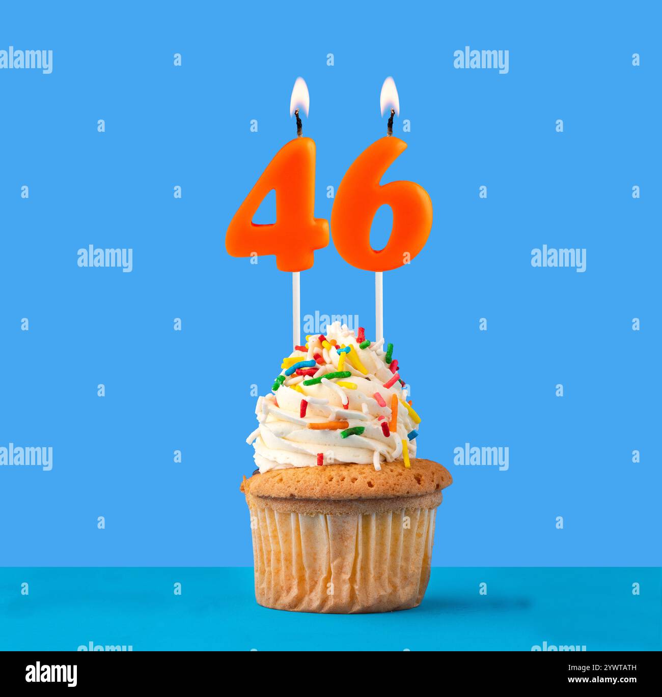 Orange candle number 46 - Birthday cupcake on blue background Stock ...