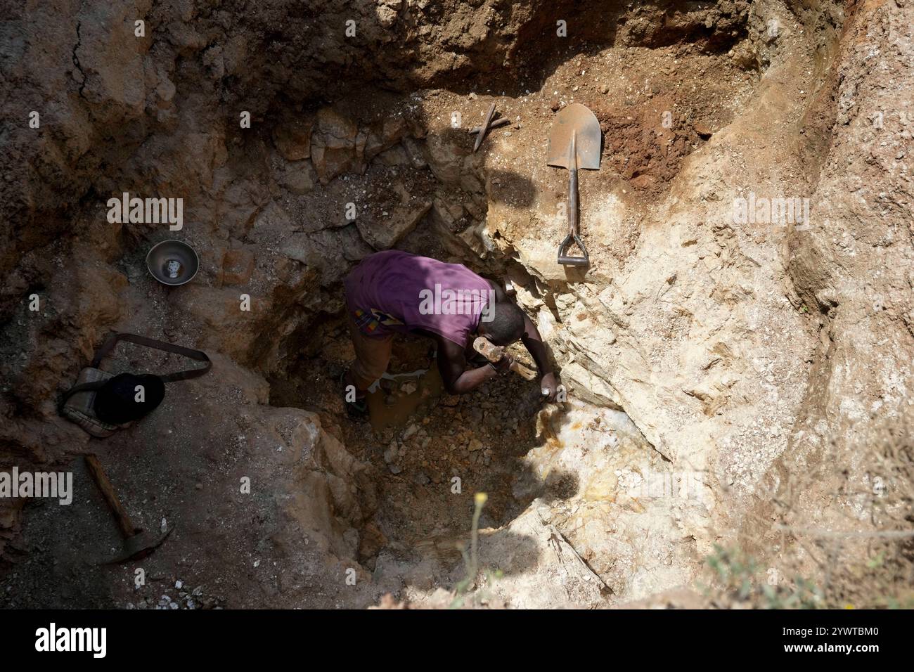Yusuf Rabiu works at an illegal lithium mining site in Paseli, Nigeria ...