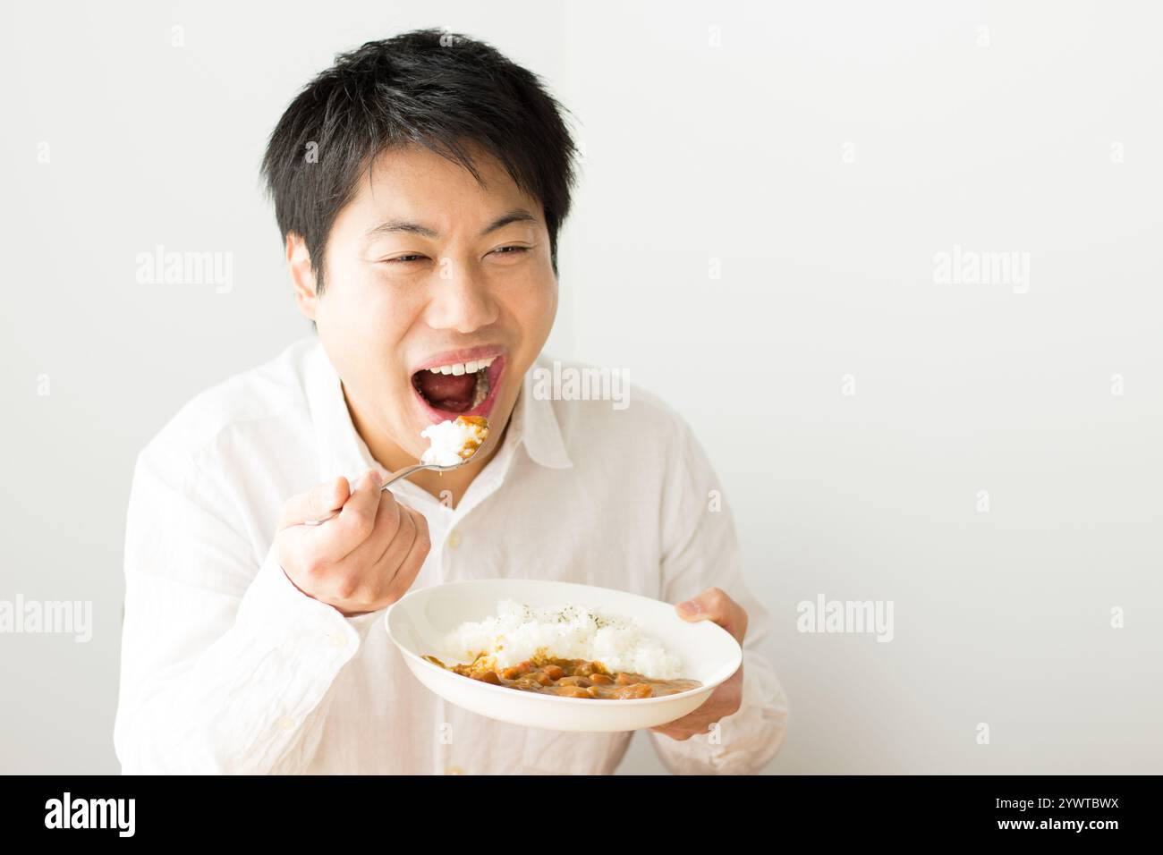Man eating curry hi-res stock photography and images - Alamy
