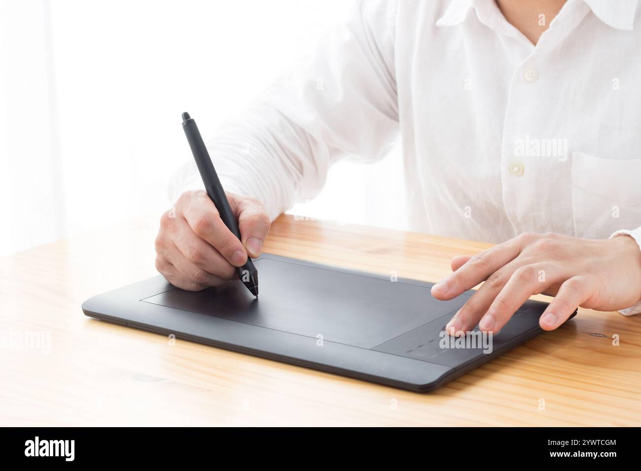 Man using pen tab Stock Photo - Alamy