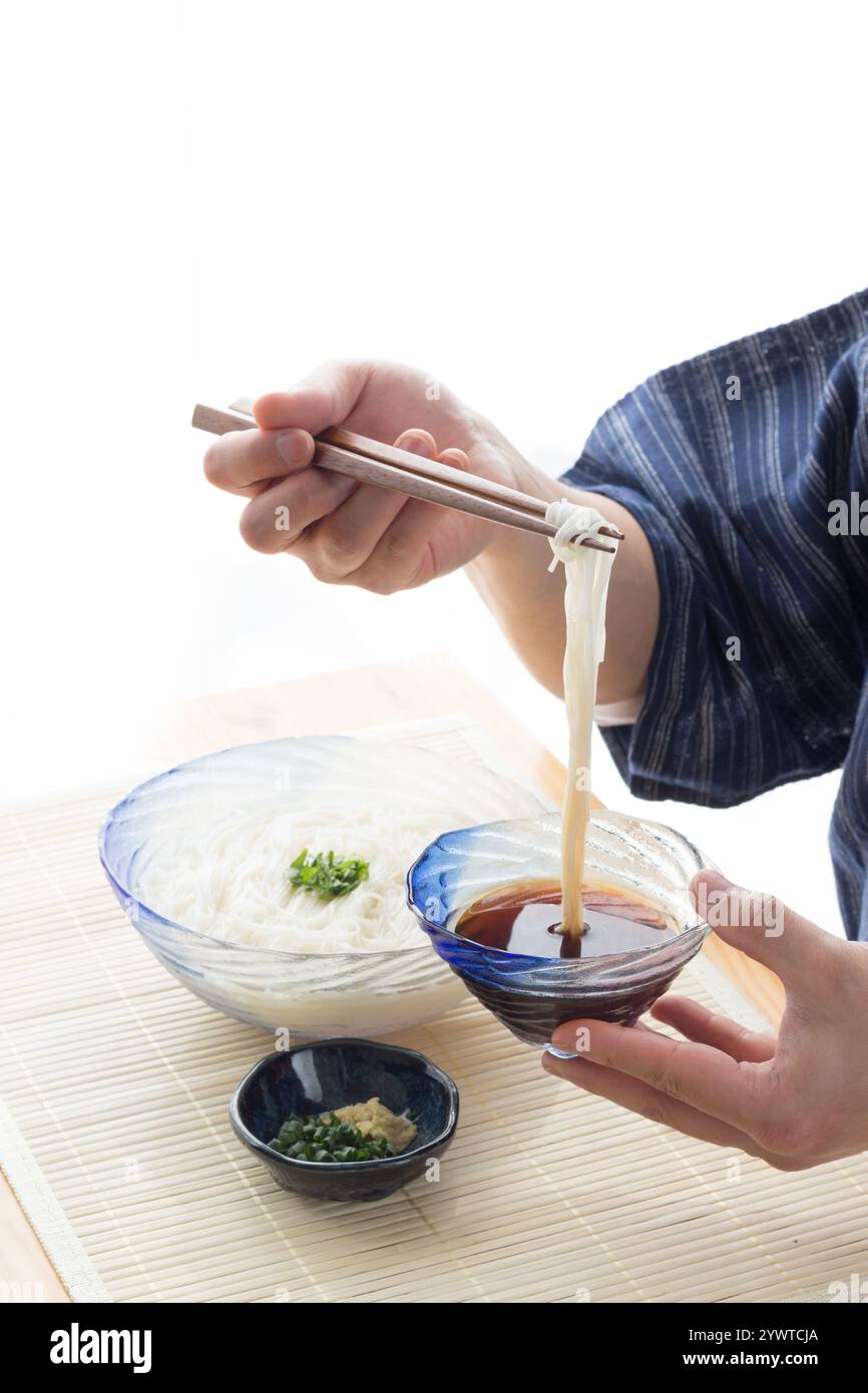 Man eating noodle soup summer hi-res stock photography and images - Alamy