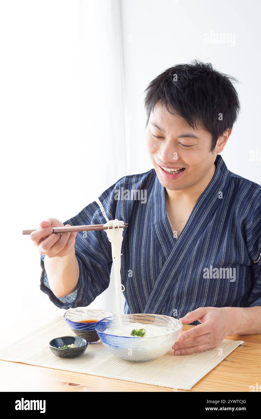 Man eating noodle soup summer hi-res stock photography and images - Alamy