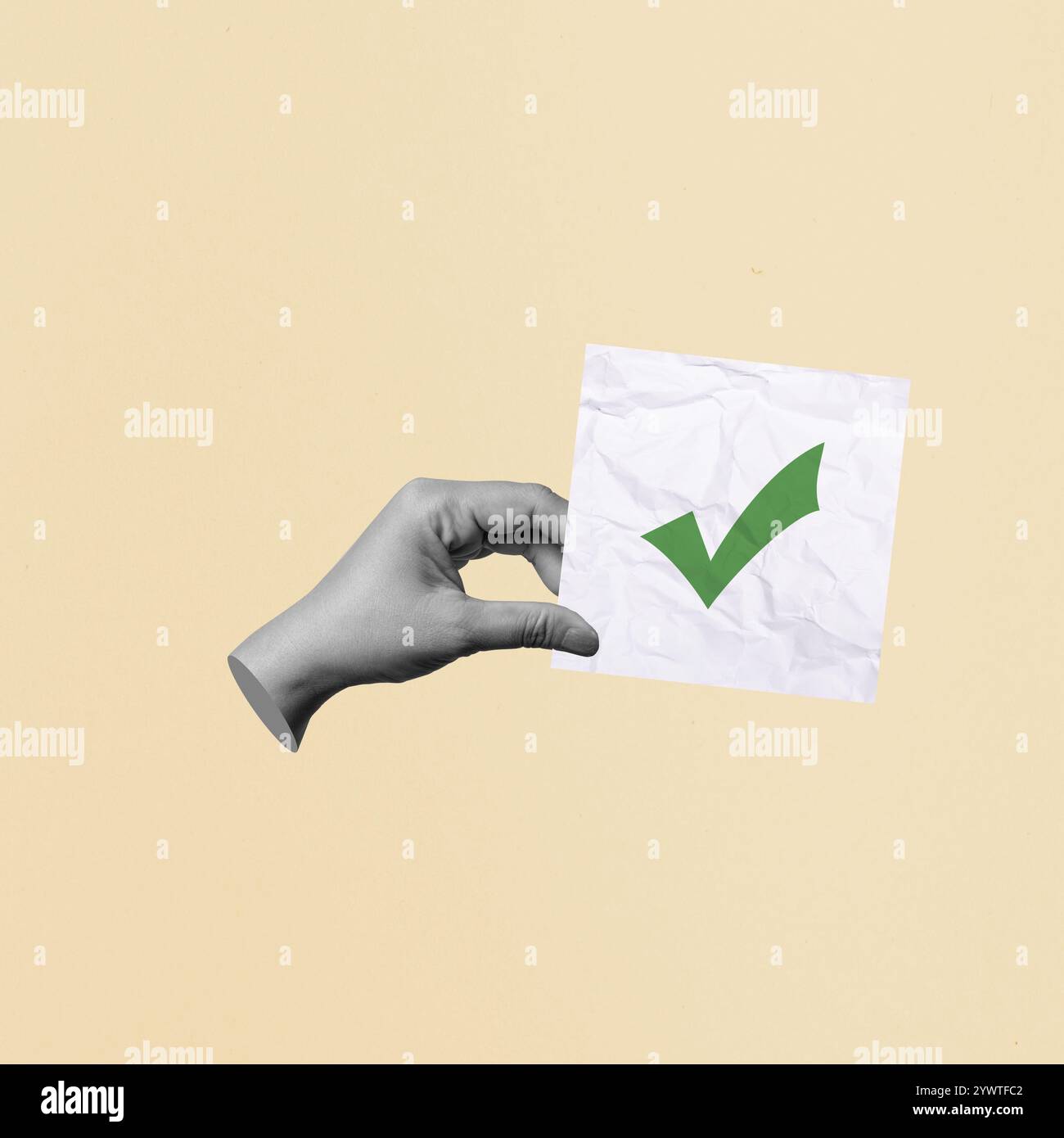 A human hand showing a checkmark symbol on a white paper with a colored ...