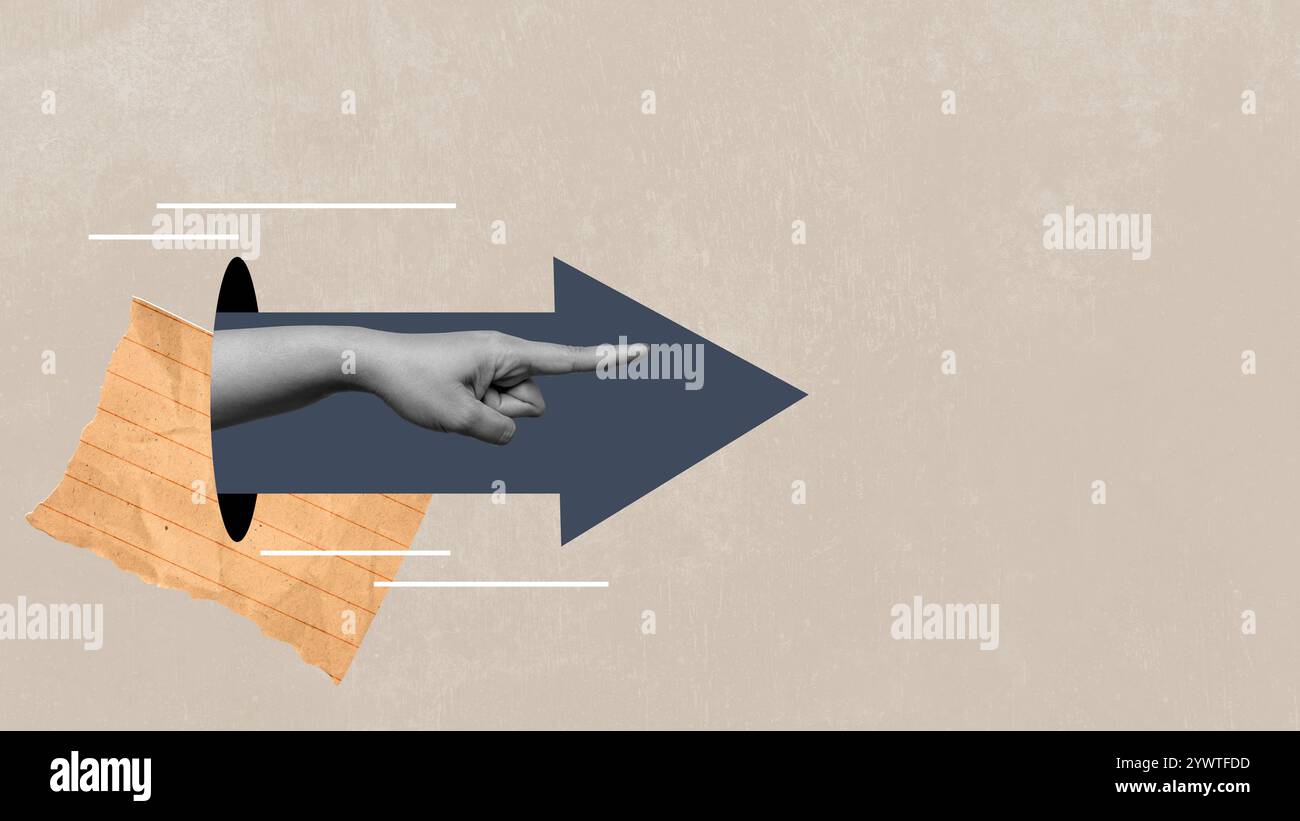 A human hand pointing through the hole with an arrow symbol on a ...