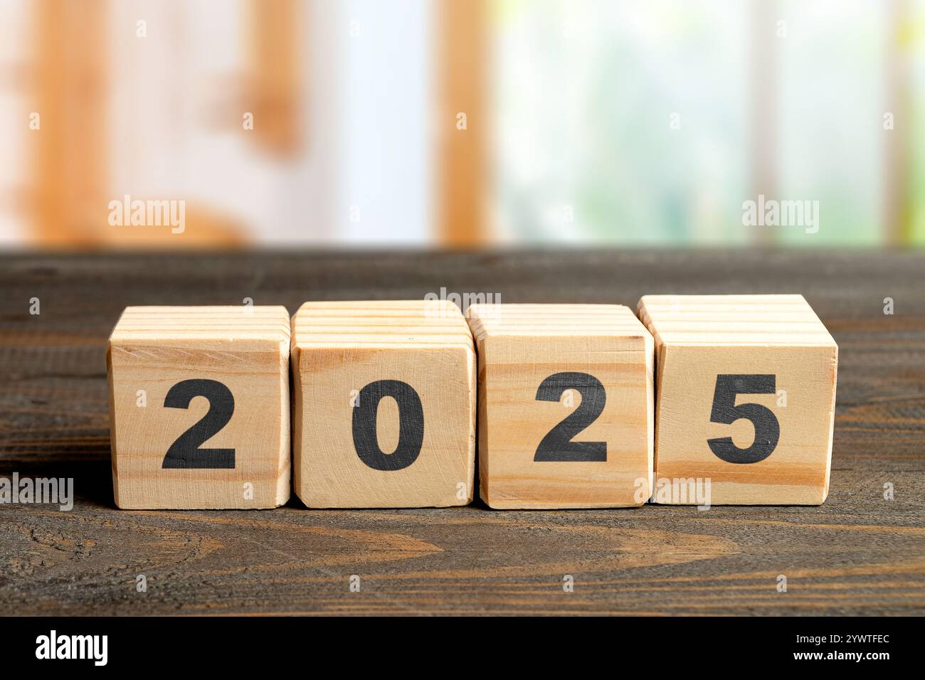 Wooden cubes with number 2025 on the table. Happy New Year concept or ...