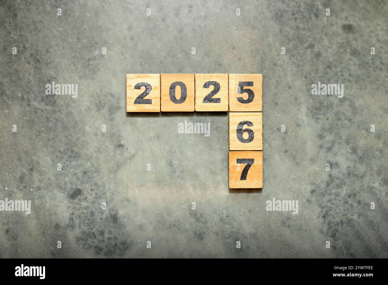 Wooden cubes with number 2025 on black background. Happy New Year ...