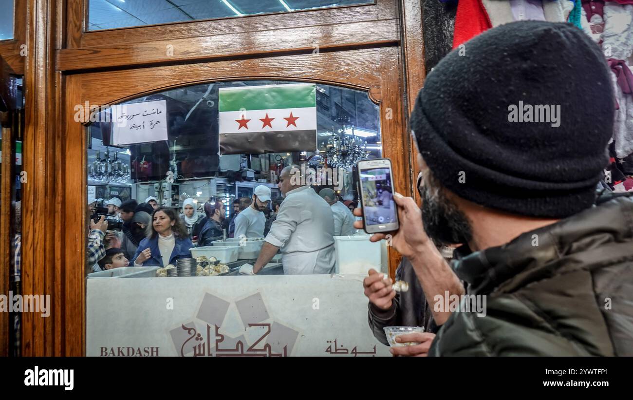 A Syrian revolution flag in the window of Bakdash, a famous ice-cream ...