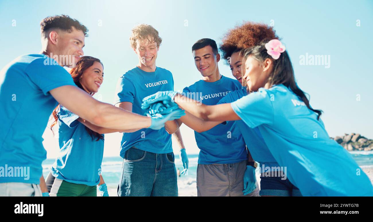 Beach, volunteer and people with hands together for support, motivation ...