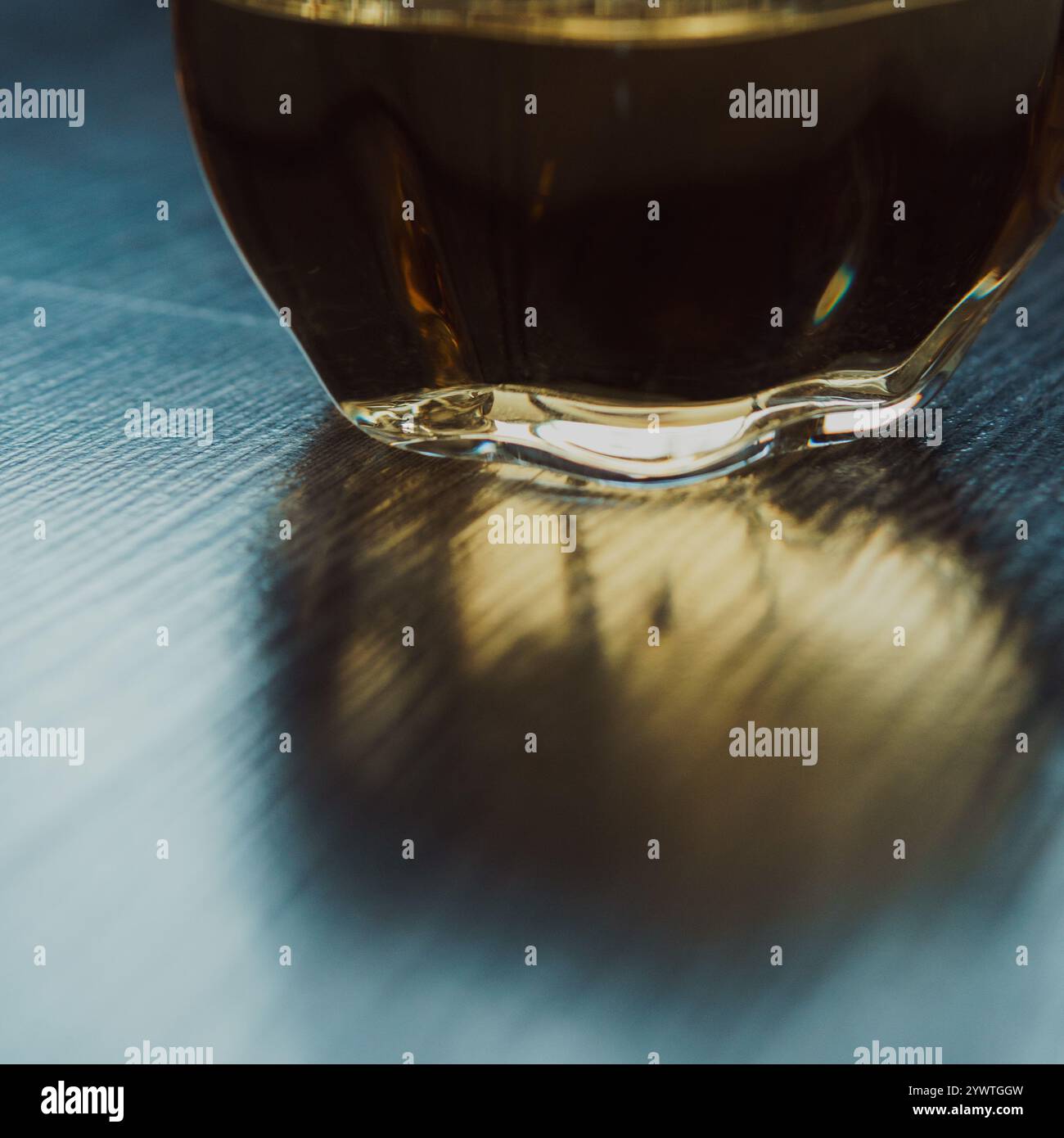 An Elegant Glass Filled with Dark Liquid on a Reflection Surface That ...