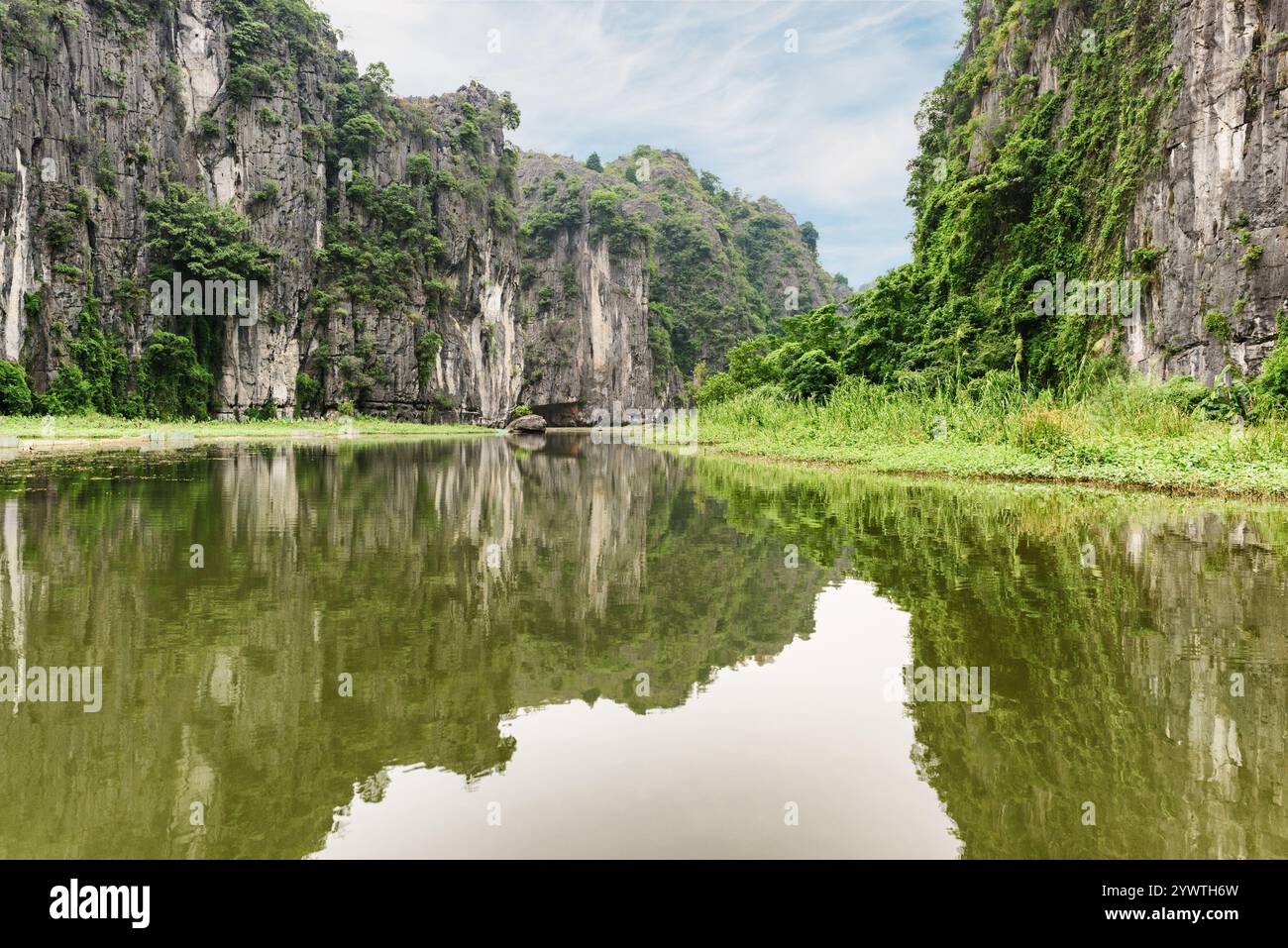 Natural karst towers reflected in the Ngo Dong River, Vietnam Stock ...