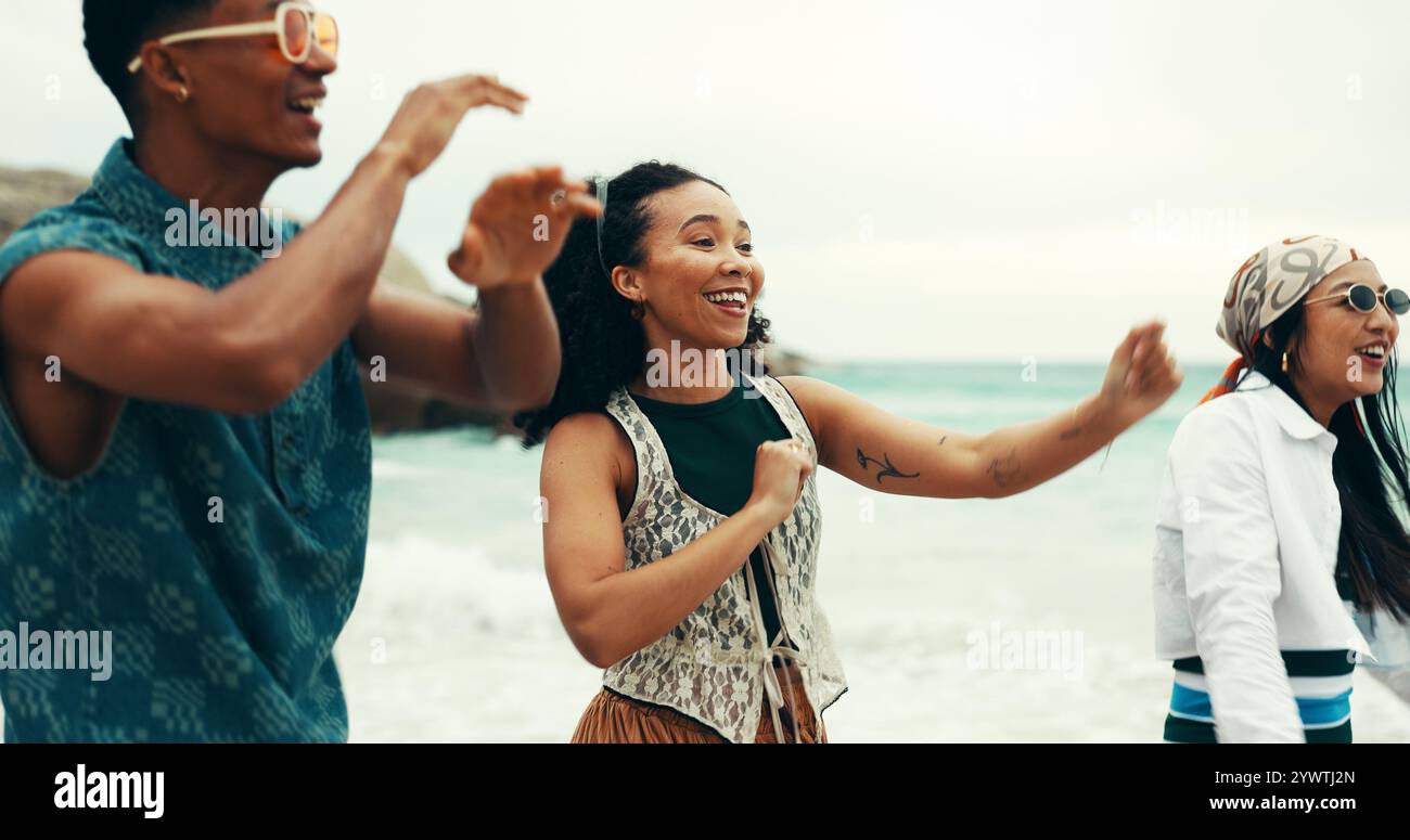 Happy, people and dancing on beach outdoor with energy, movement and ...