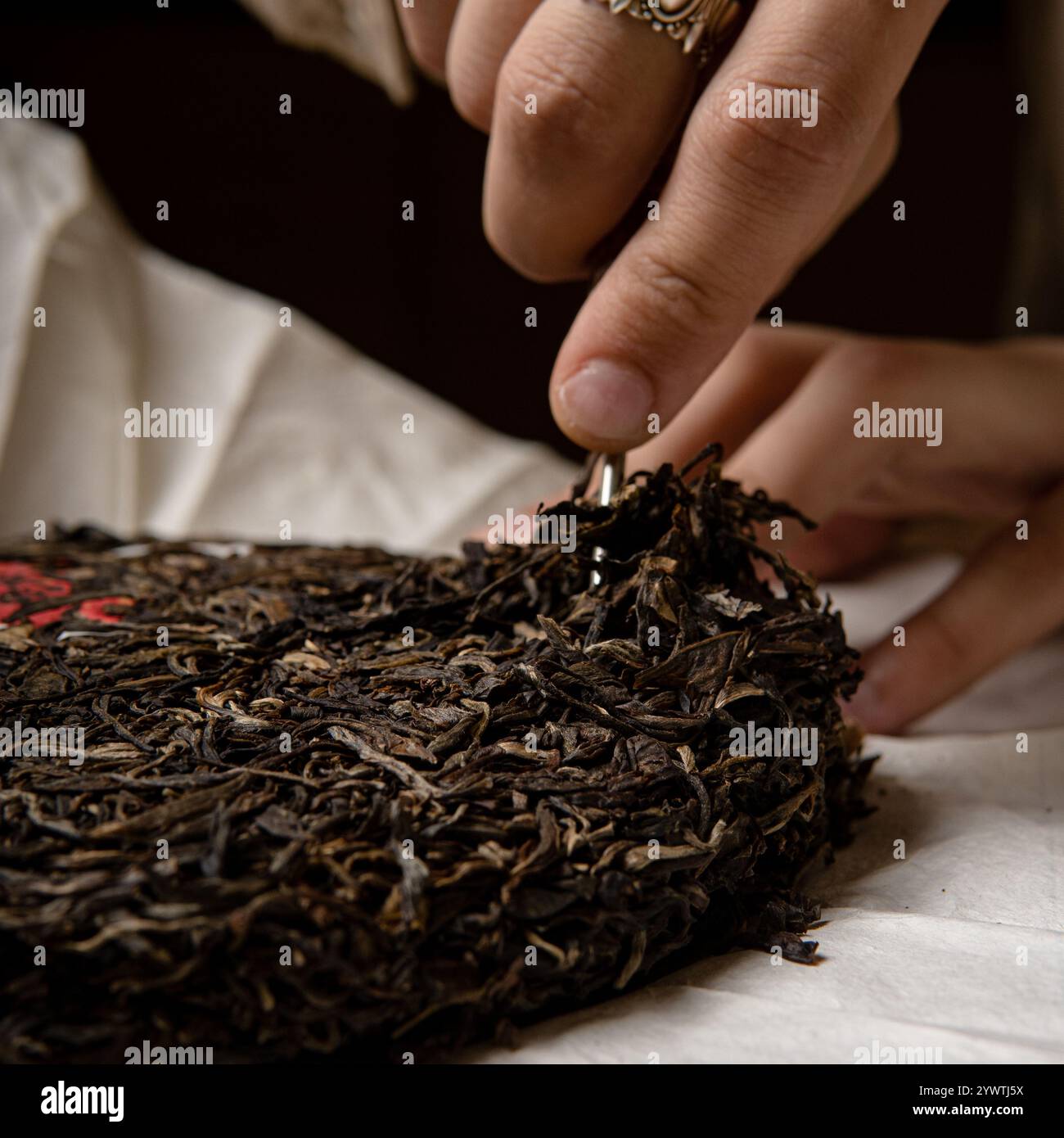 Hand Crafting a Tea Cake from Loose Tea Leaves to Create a Rich Flavor ...