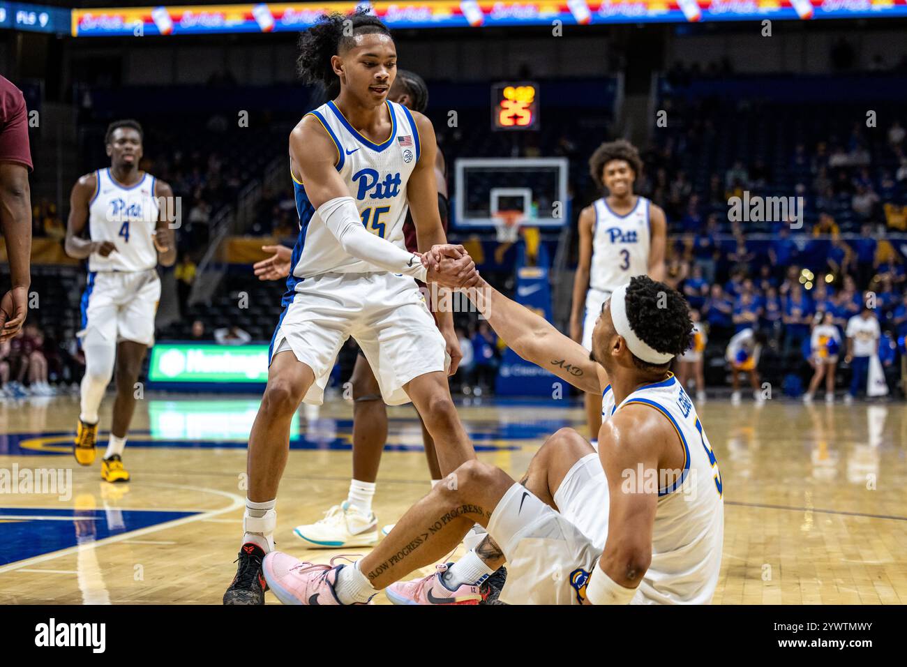December 11, 2024: Pitt Panthers guard Jaland Lowe (15) helps up ...