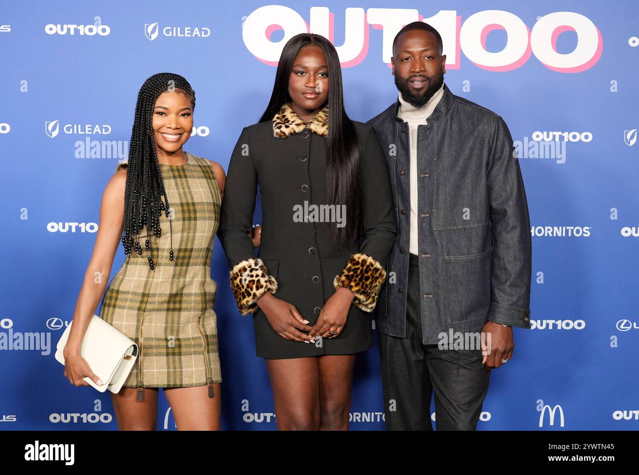 Dwyane Wade, right, and his wife Gabrielle Union, left, pose with Wade ...