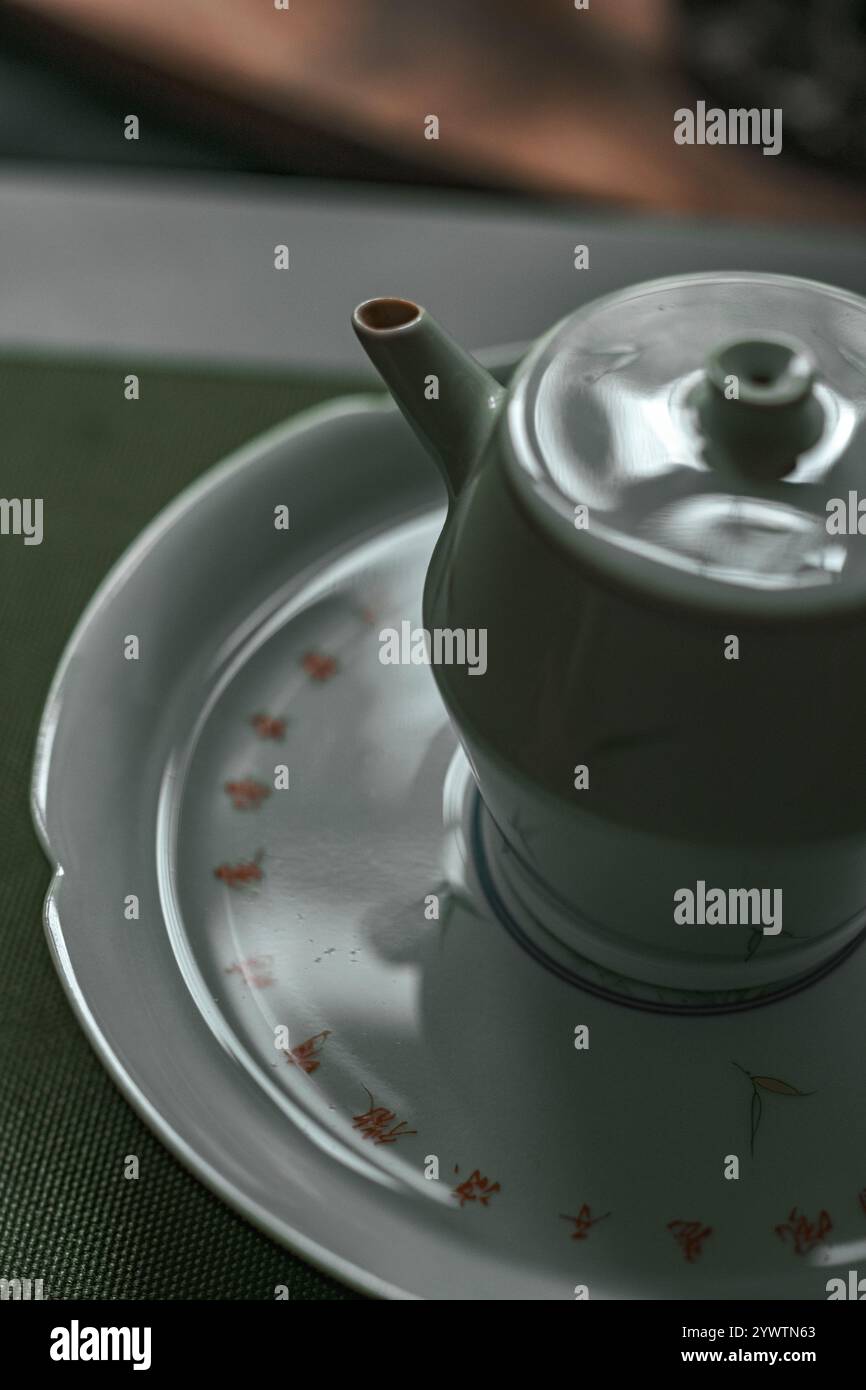An Elegant Teapot Delightfully Placed on a Stylish Saucer for a Perfect ...