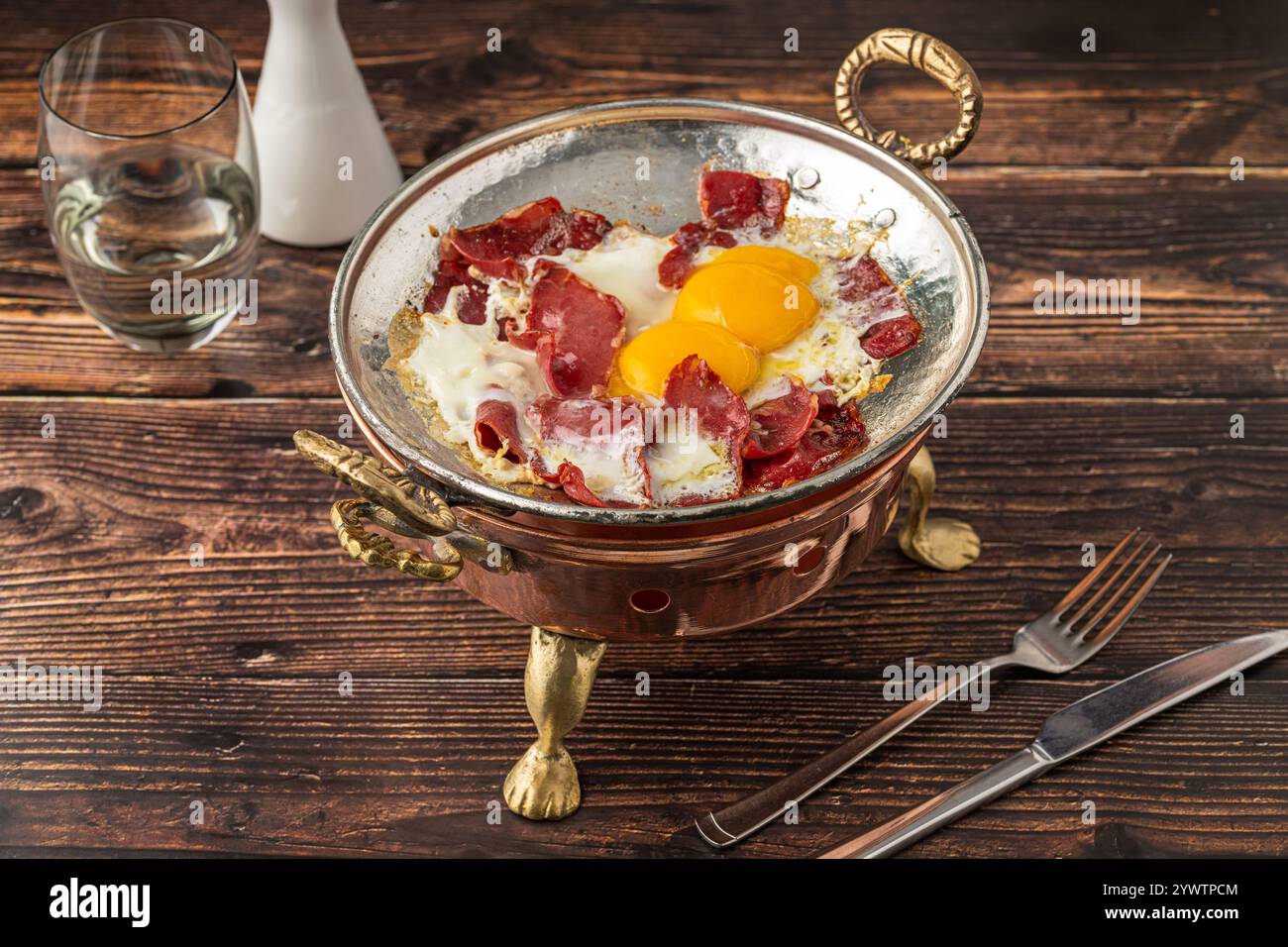 Traditional Turkish breakfast eggs with fried pastrami or bacon ...