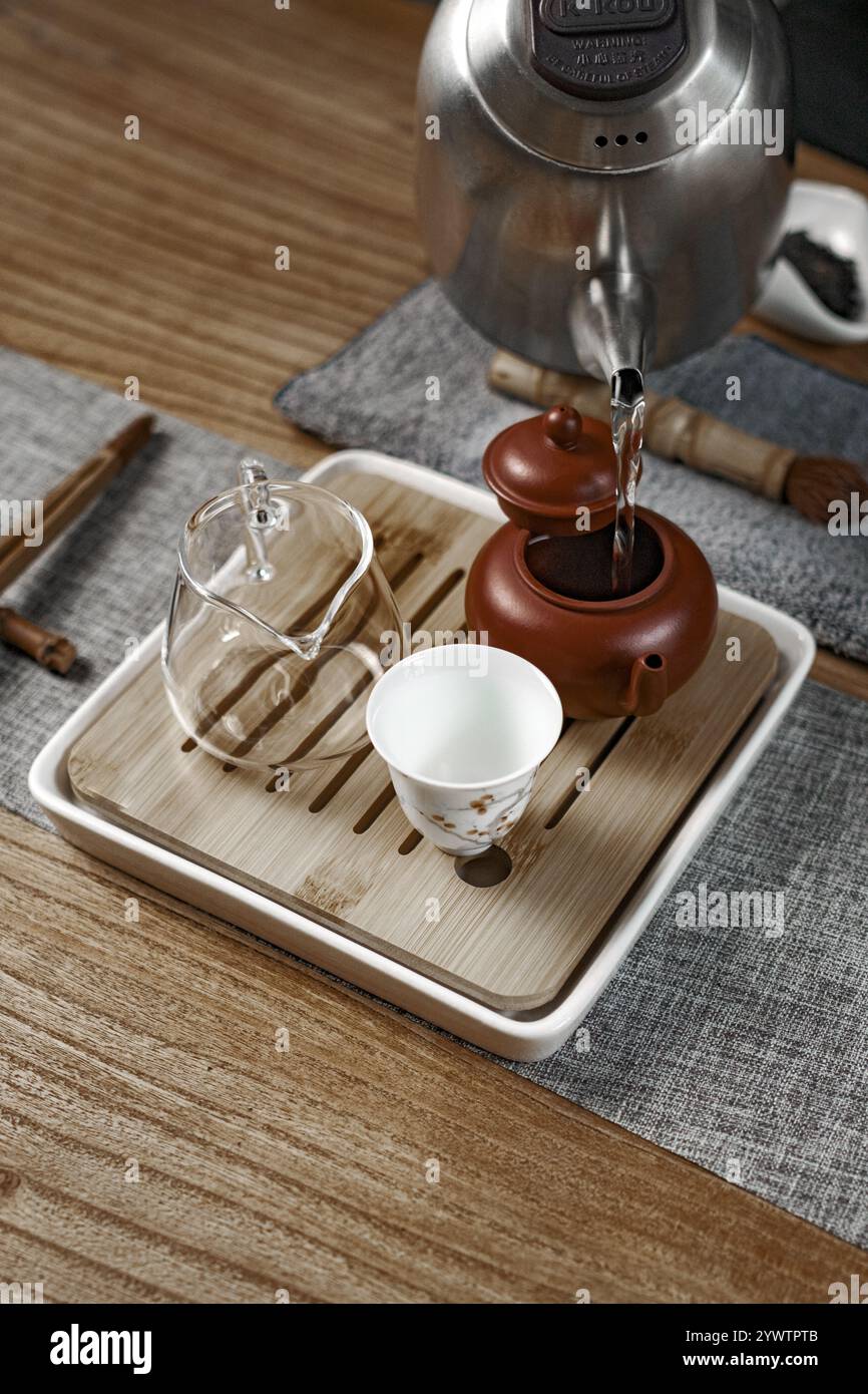 Traditional Tea Brewing Setup Featuring a Beautiful Teapot and an Array ...
