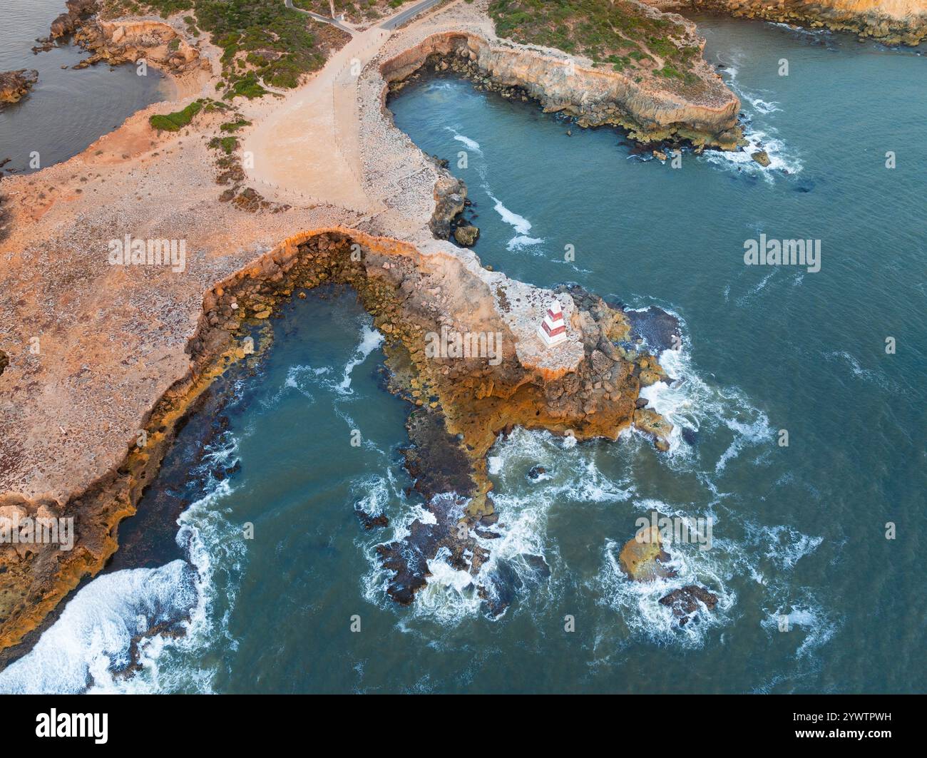 Aerial view of an obelisk monument on the edge of a rocky point at Robe ...