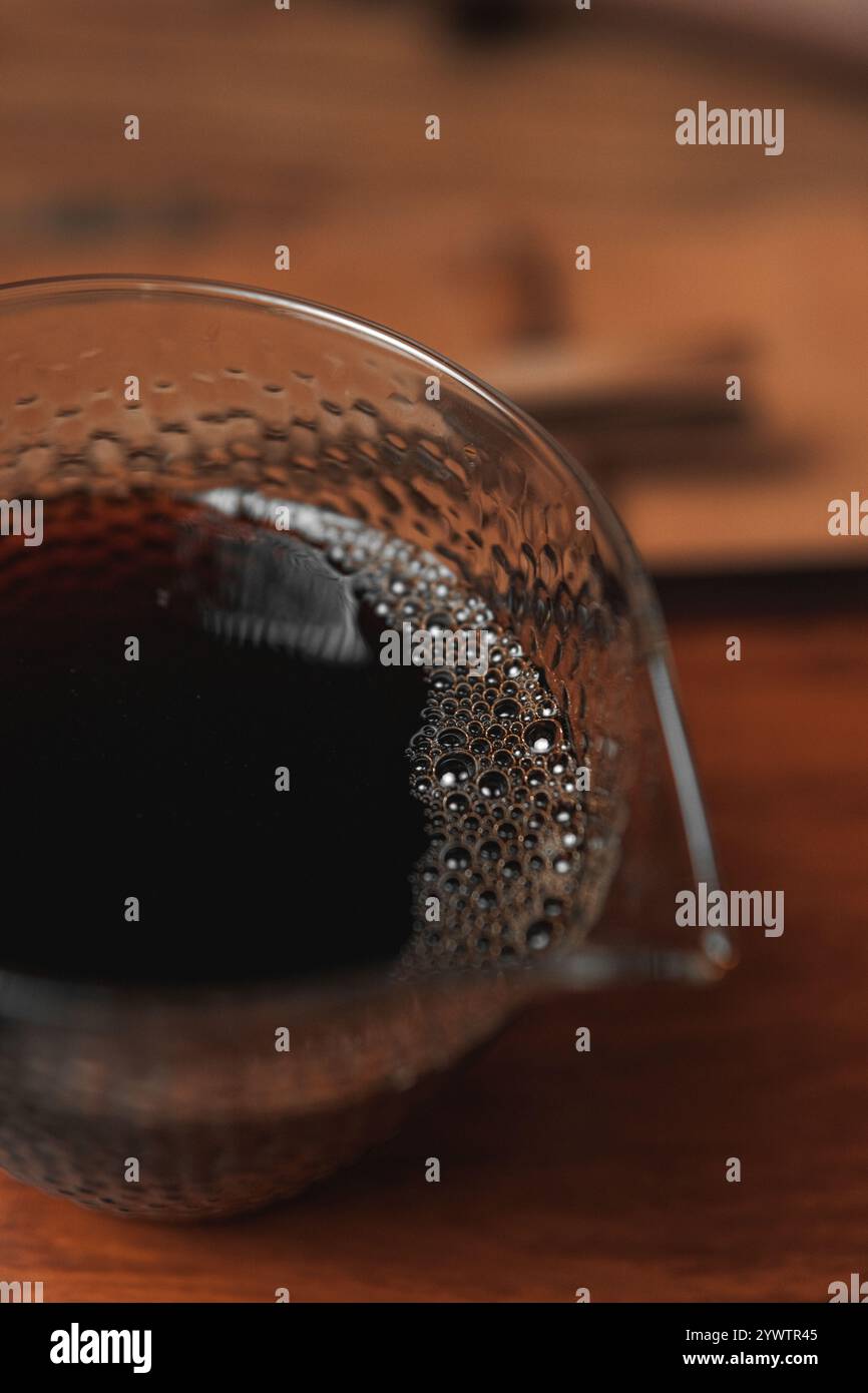 A beautiful dark brew displayed in a transparent glass container ...