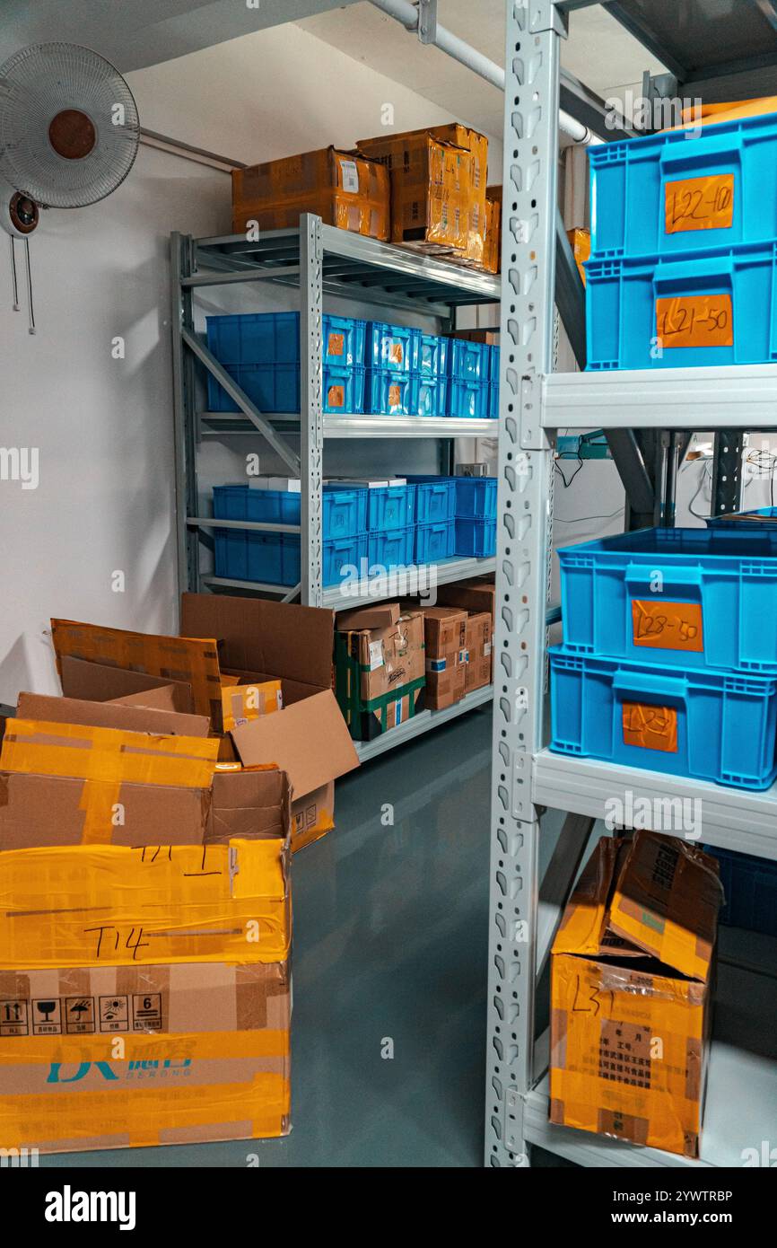 An Organized Storage Area featuring numerous Blue Plastic Bins for ...