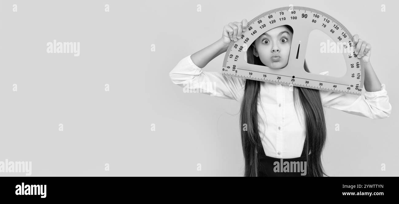 funny teen girl in school uniform hold mathematics protractor for ...