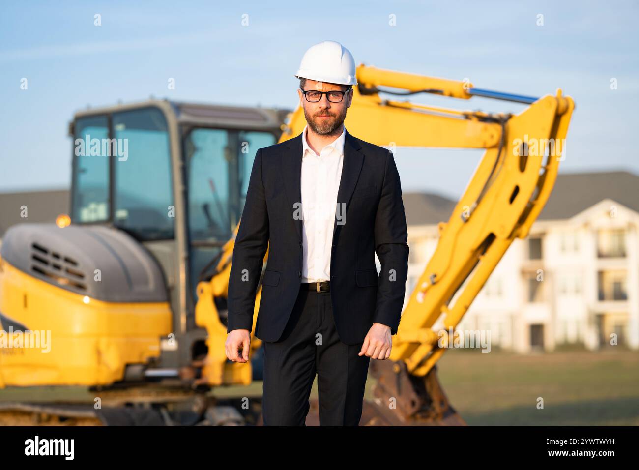Civil engineer worker at a construction site. Engineer man in front of ...