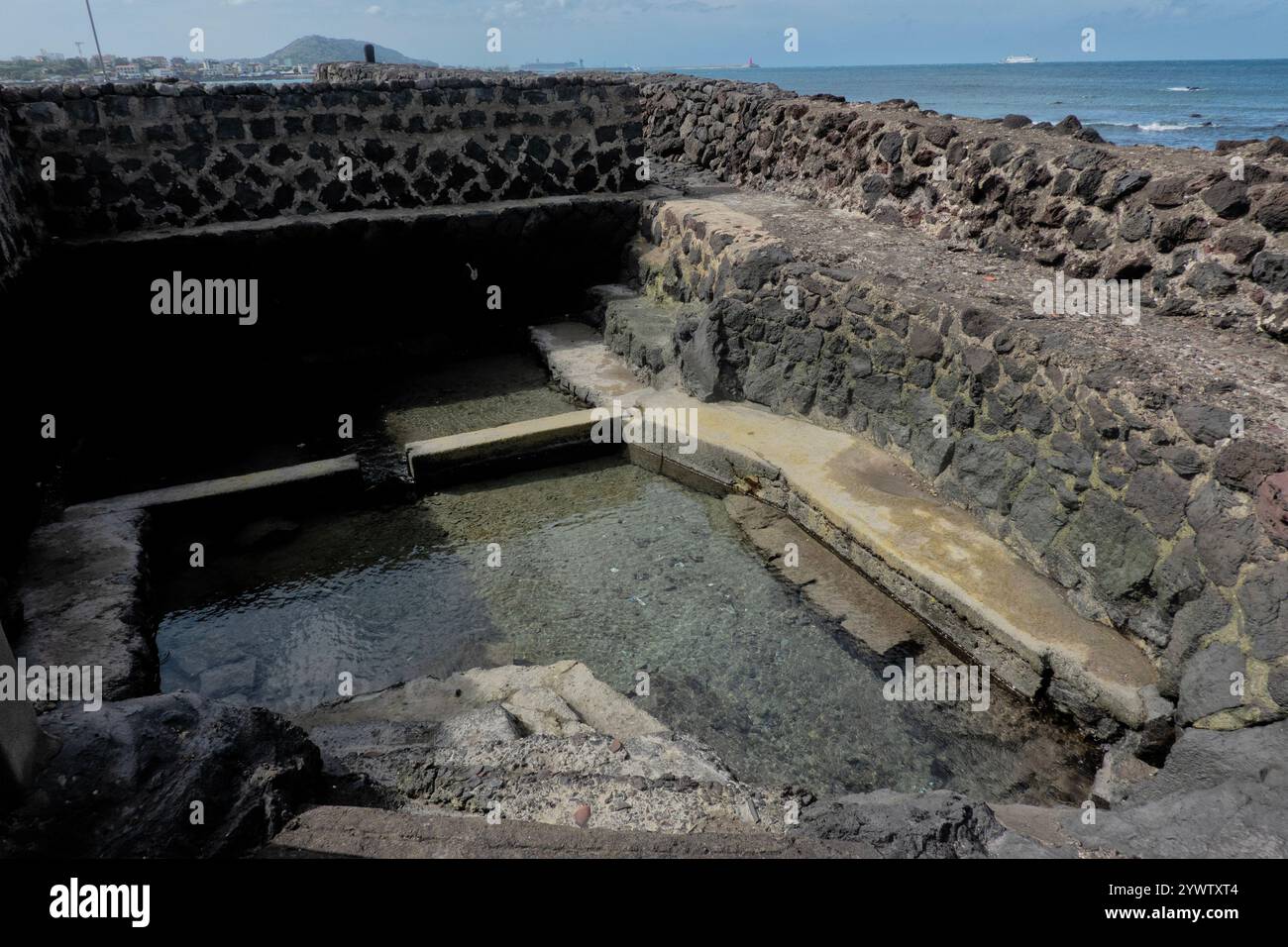 Traditional bathing pool along the Jeju Olle Trail in rural Jeju Island ...