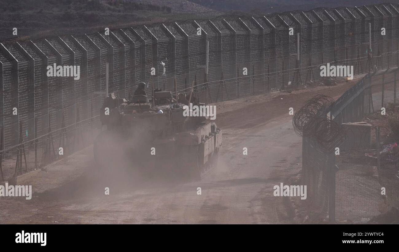 GOLAN HEIGHTS, ISRAEL- DECEMBER 11: Israeli Merkava tanks return from ...