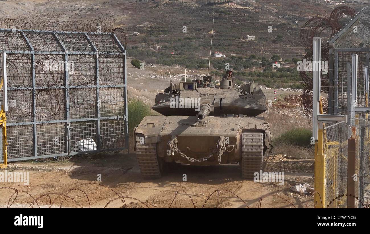 GOLAN HEIGHTS, ISRAEL- DECEMBER 11: Israeli Merkava tanks return from ...