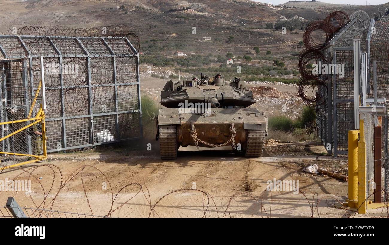 GOLAN HEIGHTS, ISRAEL- DECEMBER 11: Israeli Merkava tanks return from ...
