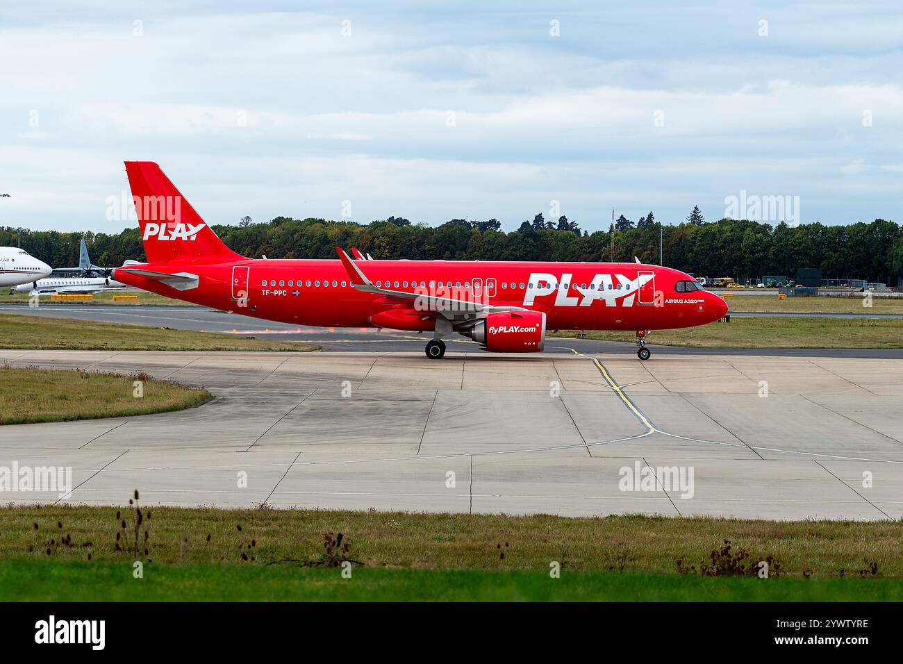 Play airlines at London Stansted. Aircraft in red with Play livery ...