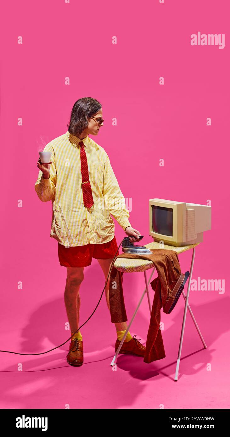 Combining retro tech with casual office wear, this man enjoys coffee ...