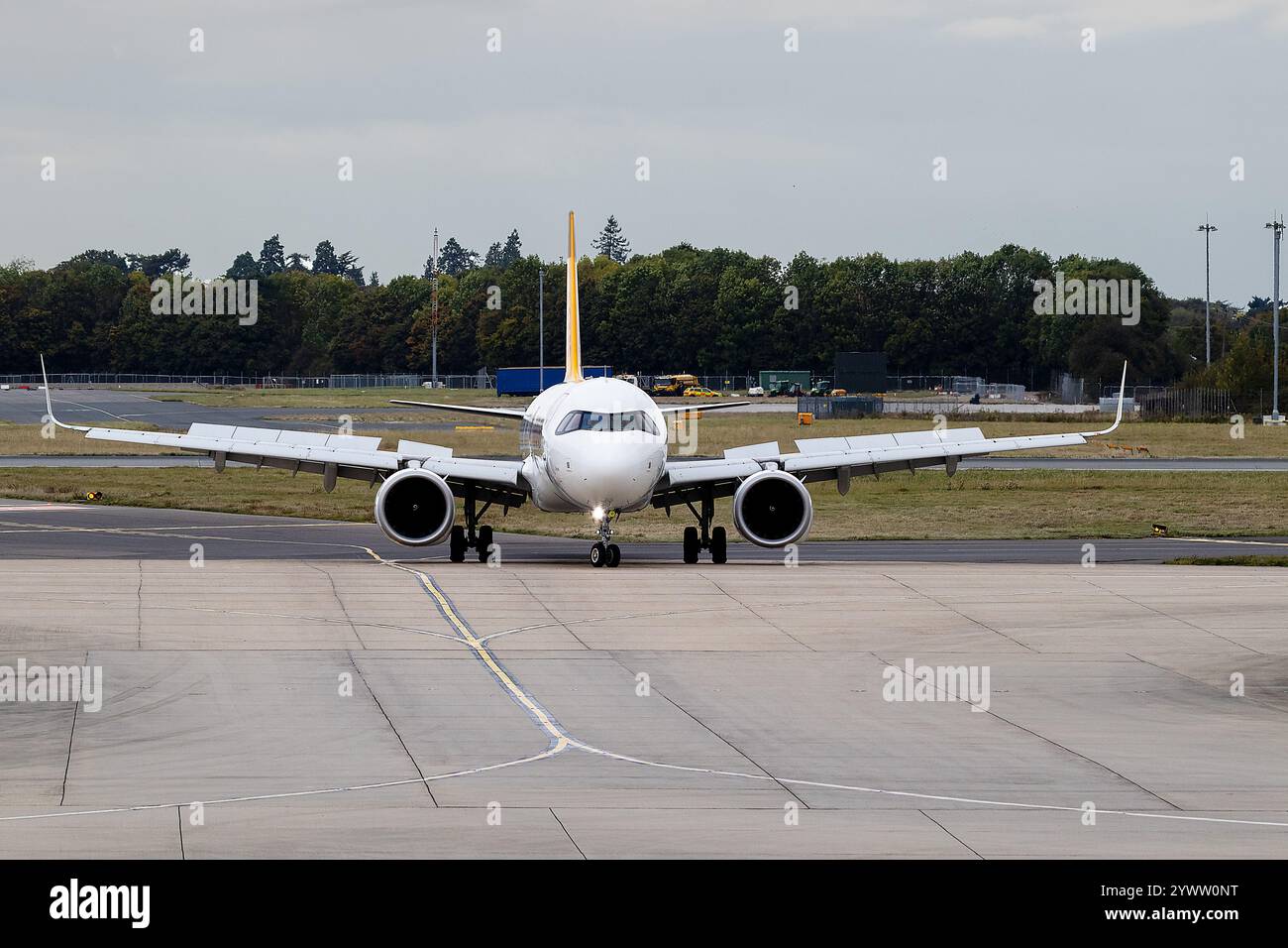 FlyPGS Airlines London Stansted. Aircraft in white and yellow livery ...