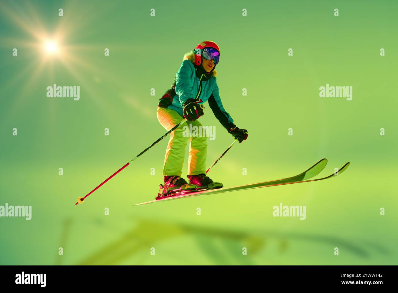 Dynamic photo of female athlete, skier landing from jump dressed yellow ...