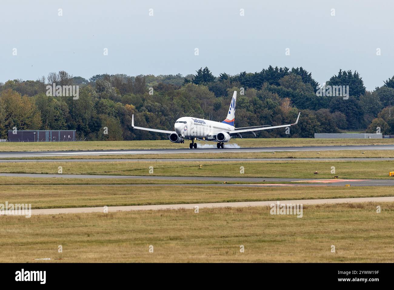 SunExpress in white and bright logos at London Stansted Stock Photo - Alamy