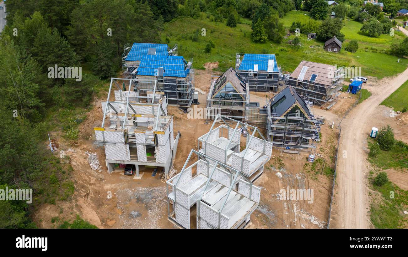 Aerial view of a residential construction site with multiple houses in ...