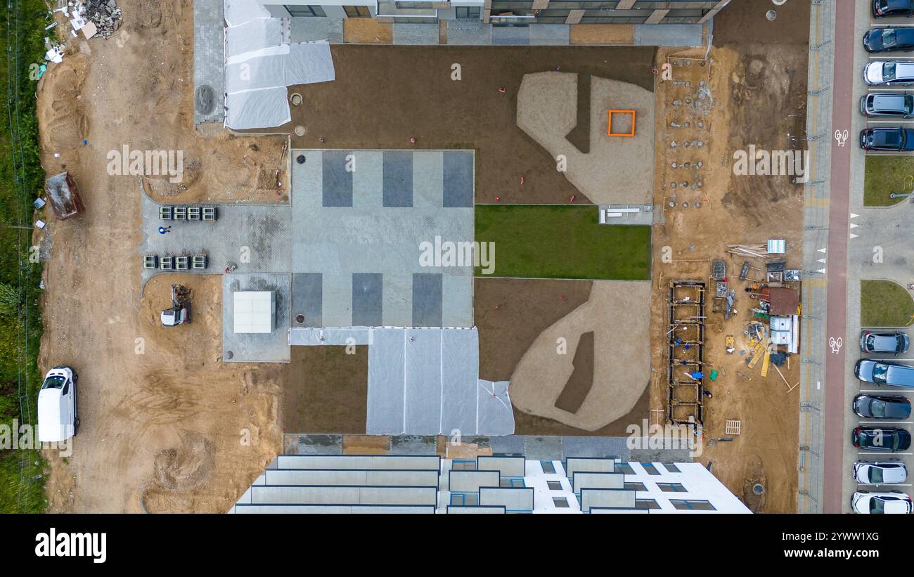 Aerial view of a construction site with a partially completed courtyard ...