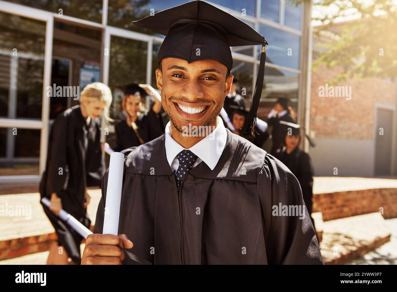 Portrait, happy man and graduate student with diploma at university for ...