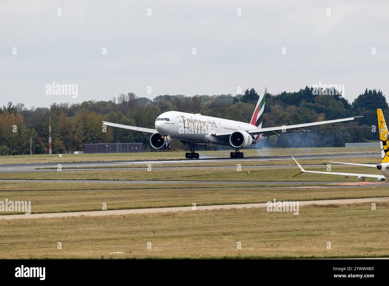 Emirates Cargo 777 London Stansted.. Aircraft is white with golden ...