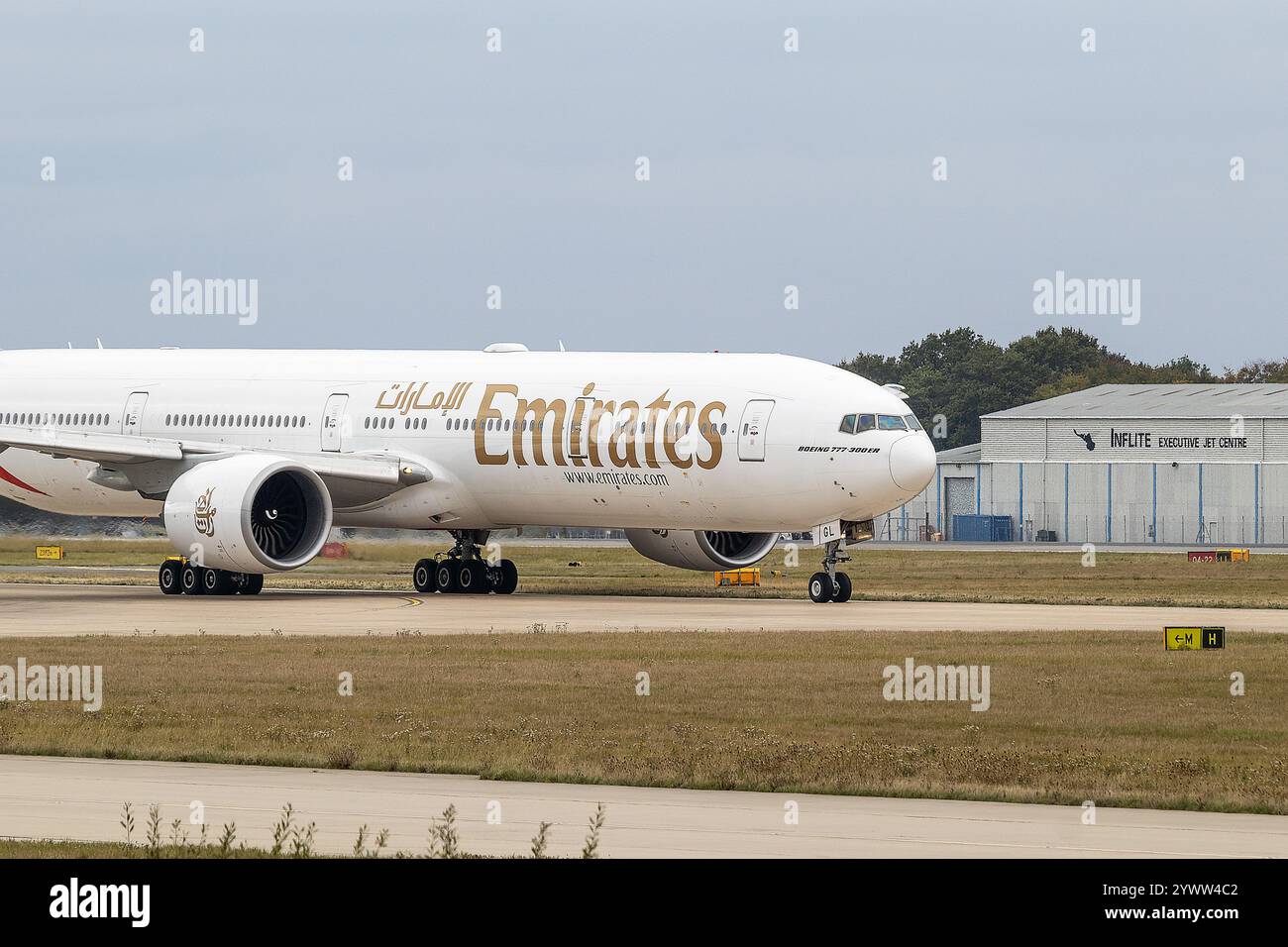 Emirates Cargo 777 London Stansted.. Aircraft is white with golden ...