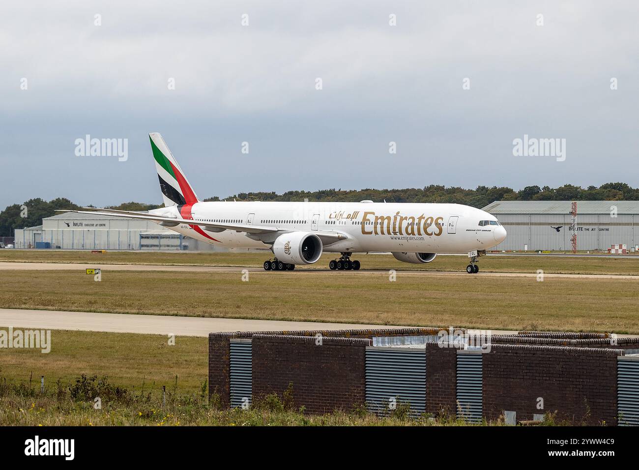 Emirates Cargo 777 London Stansted.. Aircraft is white with golden ...