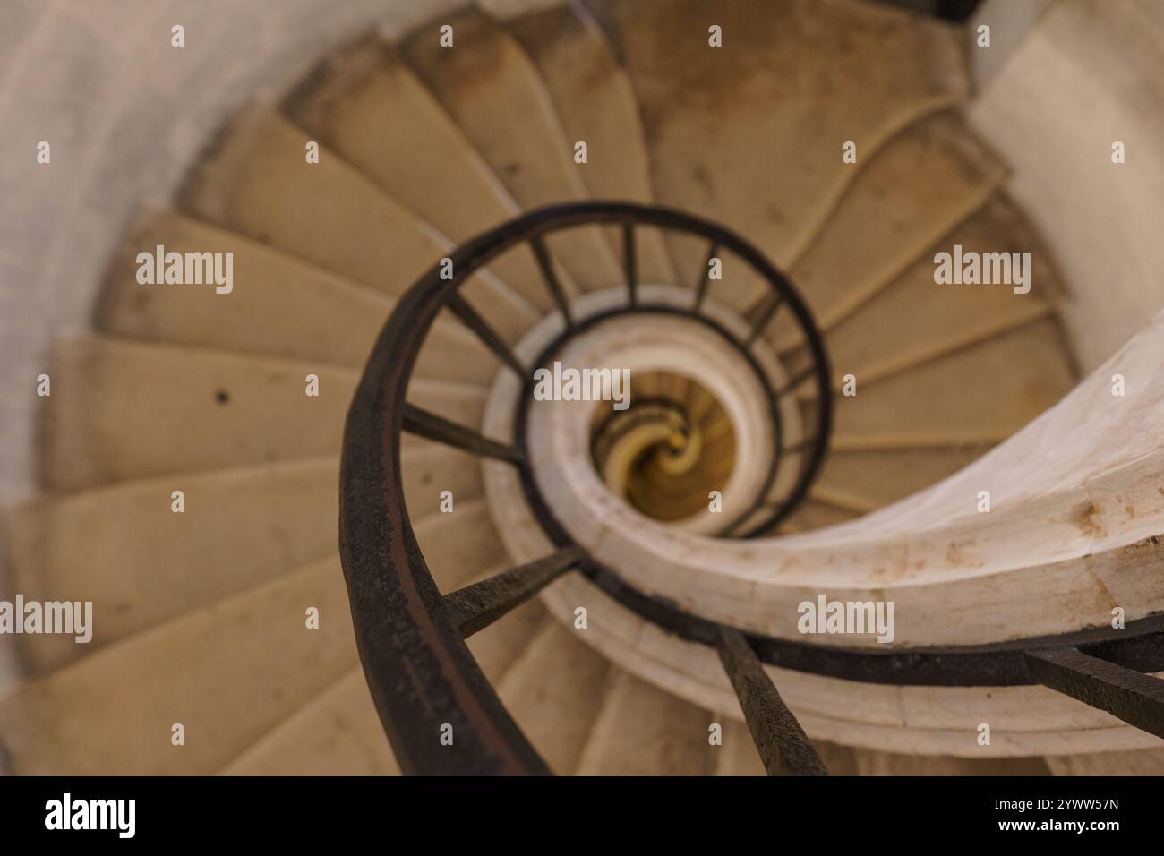 Beautiful old dilapidated spiral staircase with a metal railing ...