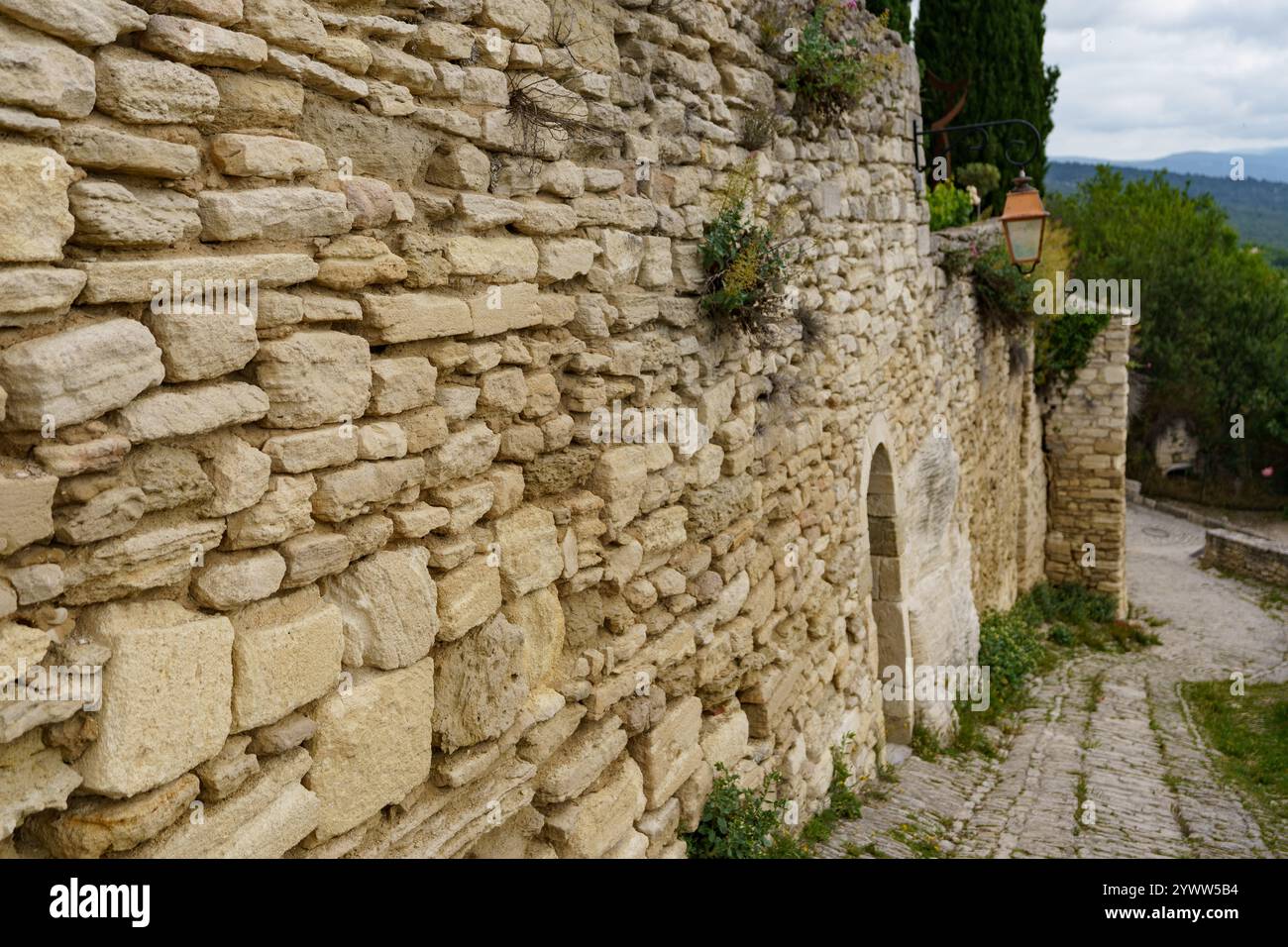 A very old wall of already destroyed stones with crumbling mortar Stock ...