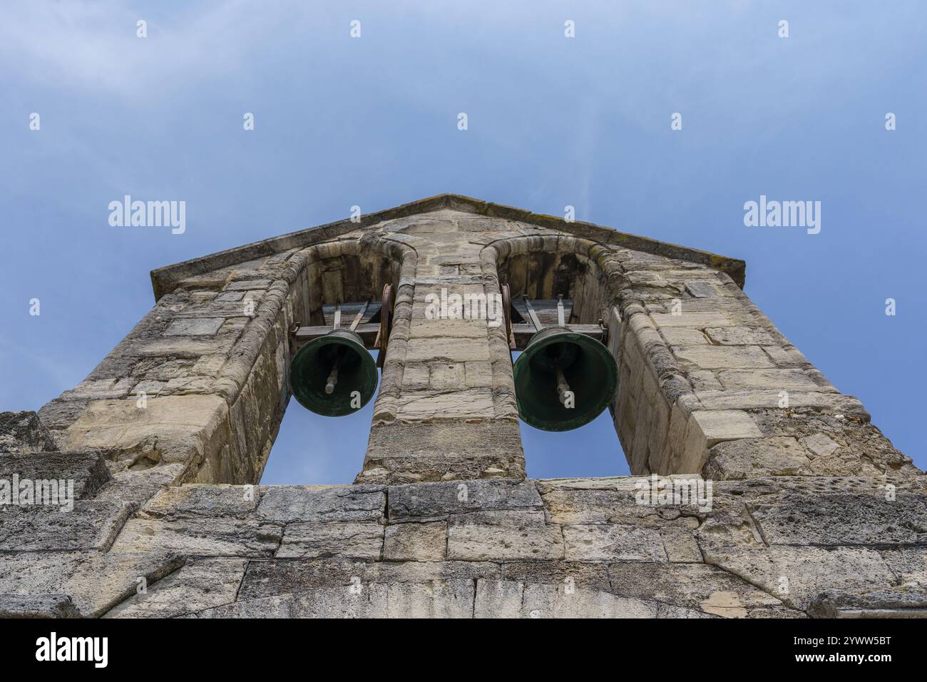 A small brick wall crowning the building, and its triangular vault ...